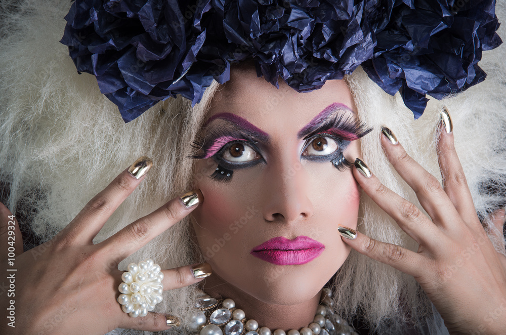 Drag queen with spectacular makeup, glamorous trashy look, posing while ...