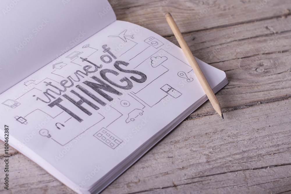 Internet of things . Pencil sketch drawing on a notebook. Wood texture ...