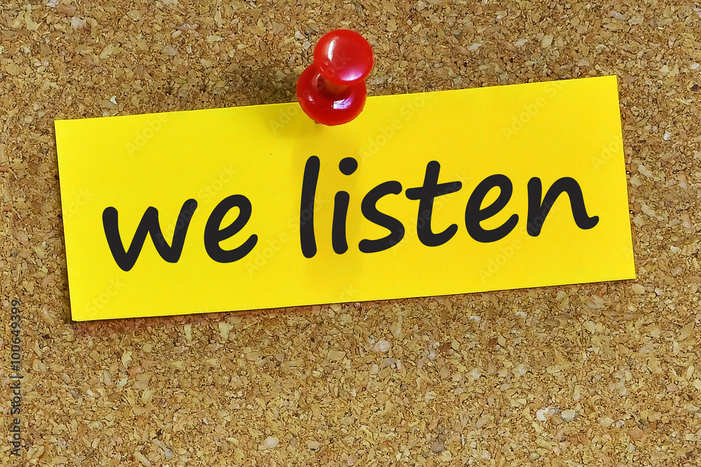 we listen word on yellow notepaper with cork background Stock Photo ...