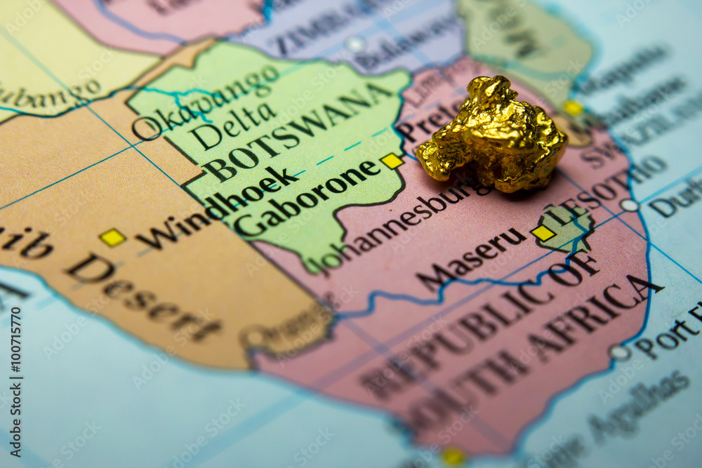 Close-up of a gold nugget on top of a map of South Africa Stock Photo ...