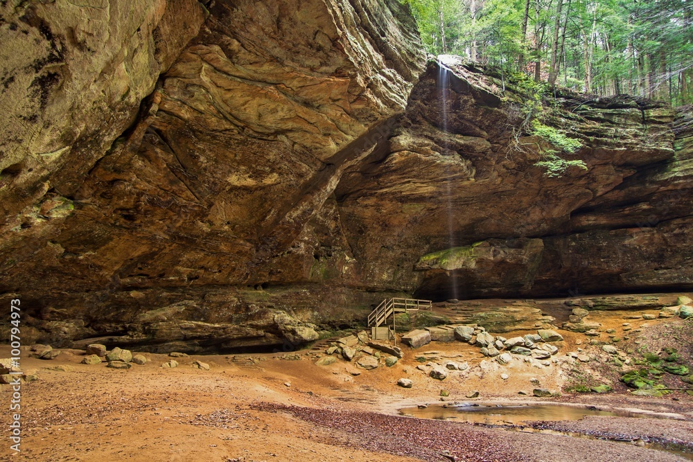 Waterfall Cave. Waterfall flows over the cliff of Ash Cave in Hocking ...