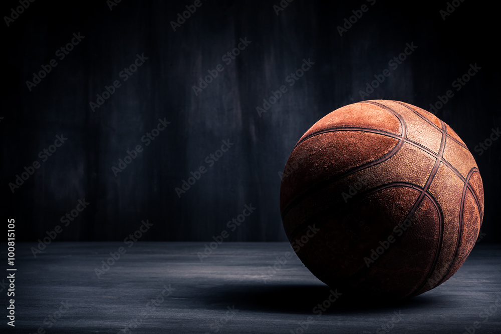 Old basketball ball on a black background Stock Photo | Adobe Stock