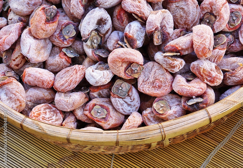 Basket of Hoshigaki air dried persimmon kaki fruit, a Japanese delicacy ...