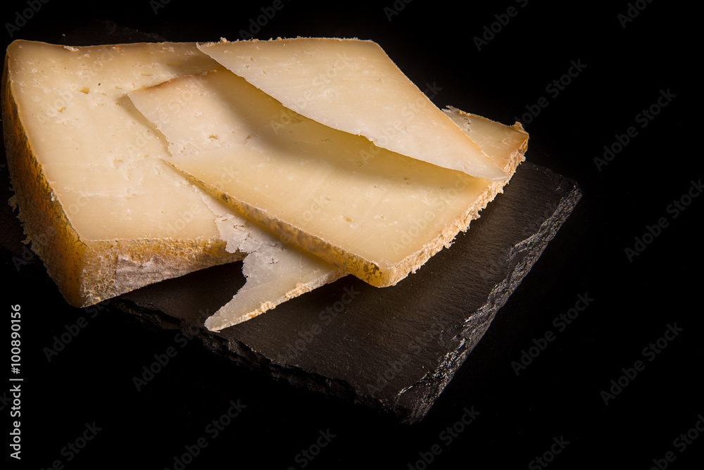 Some sliced typical Pecorino cheese on a dark tray . Stock Photo ...