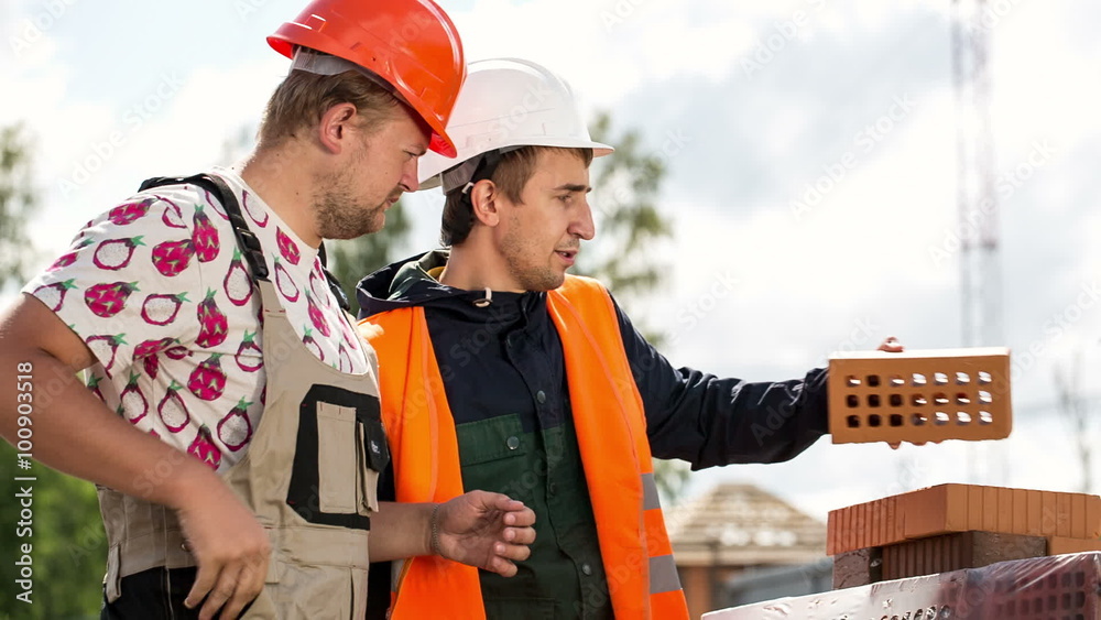 engineer and builder are on the construction site. Engineer ...