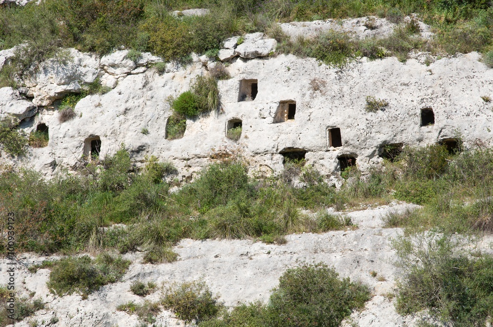 Siculi tombs at the ruins of the medieval town of Noto Antica ...