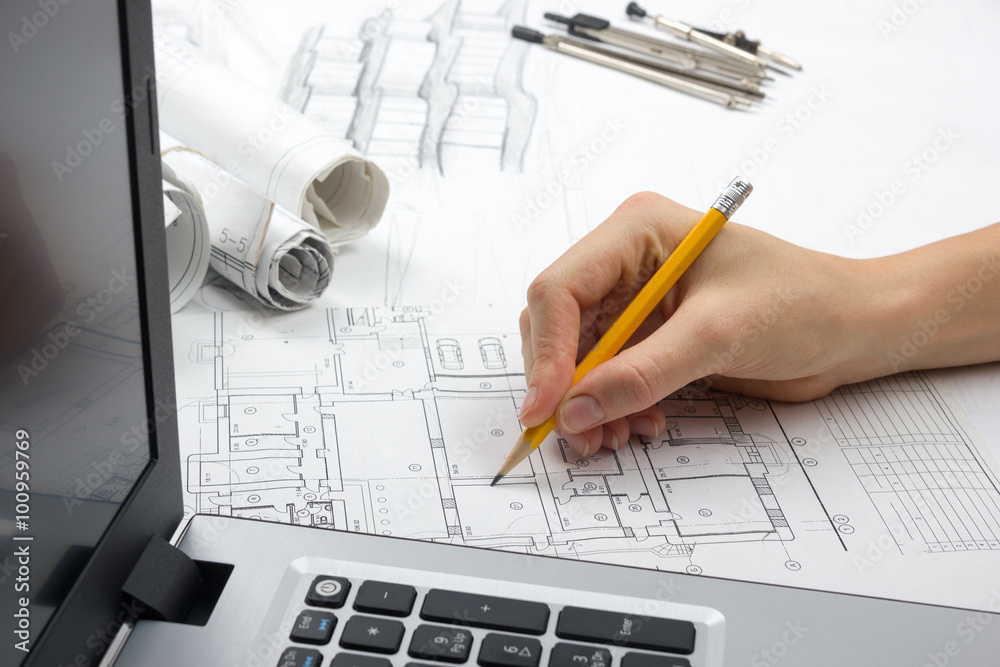 Architect working on blueprint. Architects workplace - architectural ...