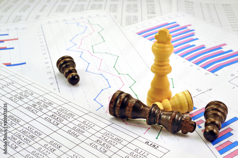 Photos chess pieces with graphs and numbers in the tables Stock Photo ...