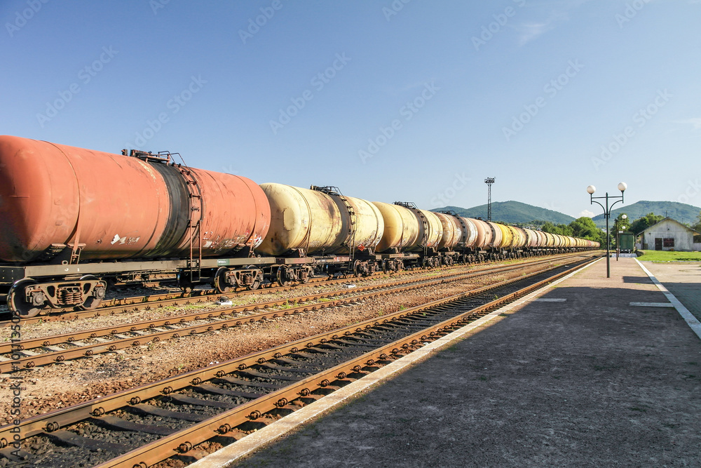 Freight trains.Railroad train of tanker cars transporting crude oil on ...