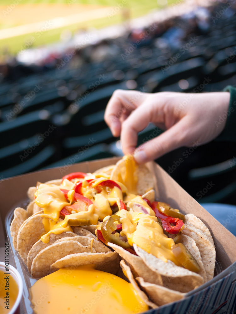 Person Eating Sports Stadium Food Stock Photo | Adobe Stock