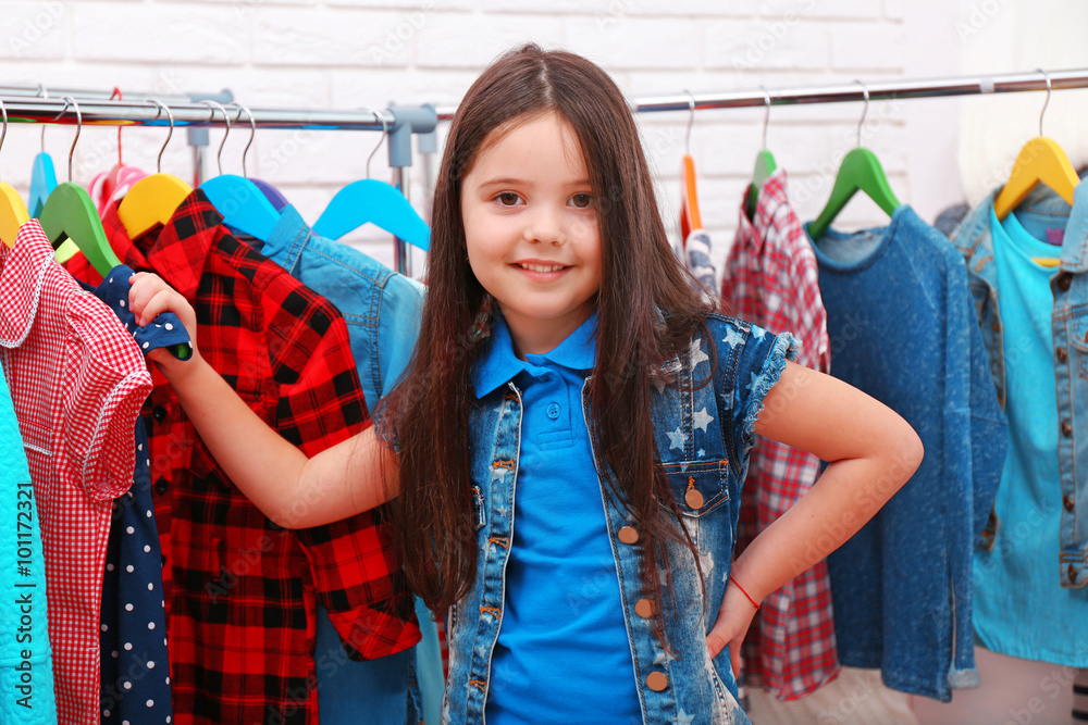Little girl trying out a new jeans sit Stock Photo | Adobe Stock
