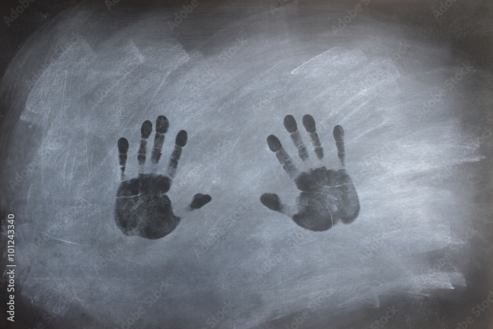 Chalkboard Hand Prints. Hand prints on a smudged black chalkboard ...