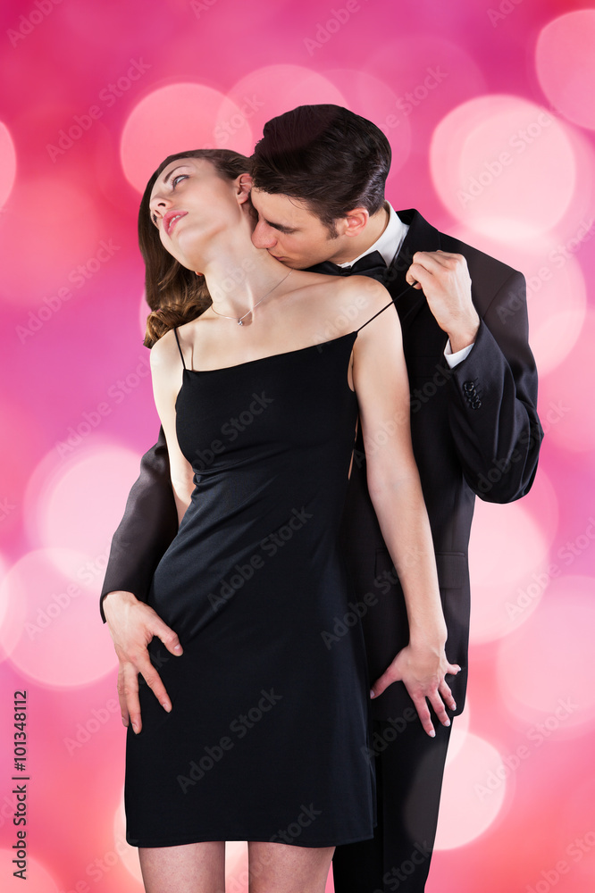 Man Kissing Woman's Neck While Removing Shoulder Strap Stock Photo ...