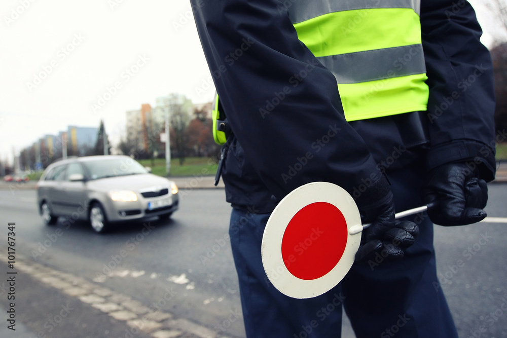 A police man checking the traffic. Stock Photo | Adobe Stock