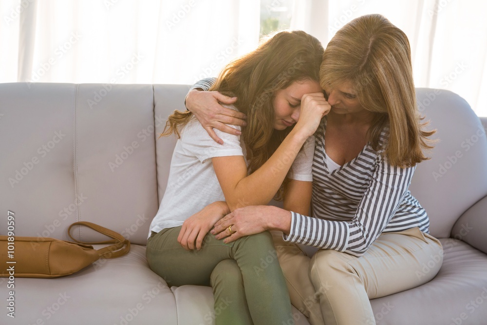Mother comforting her teenage daughter Stock Photo | Adobe Stock