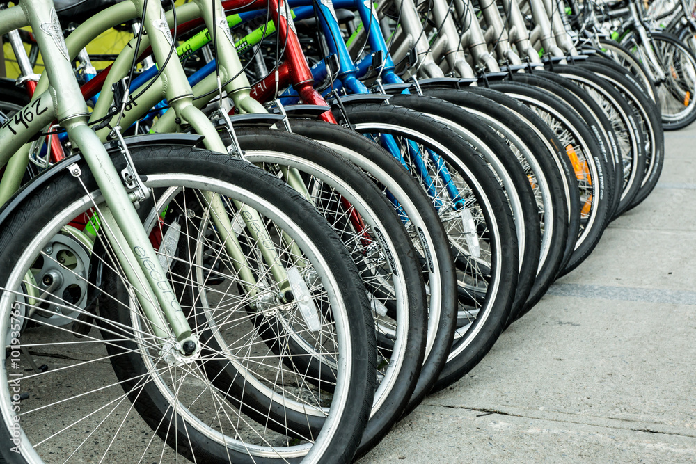 Bicycle Wheels in a Row Stock Photo | Adobe Stock