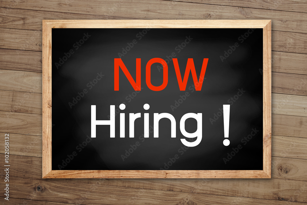 Now hiring concept on chalkboard and background with Brown wood Stock ...