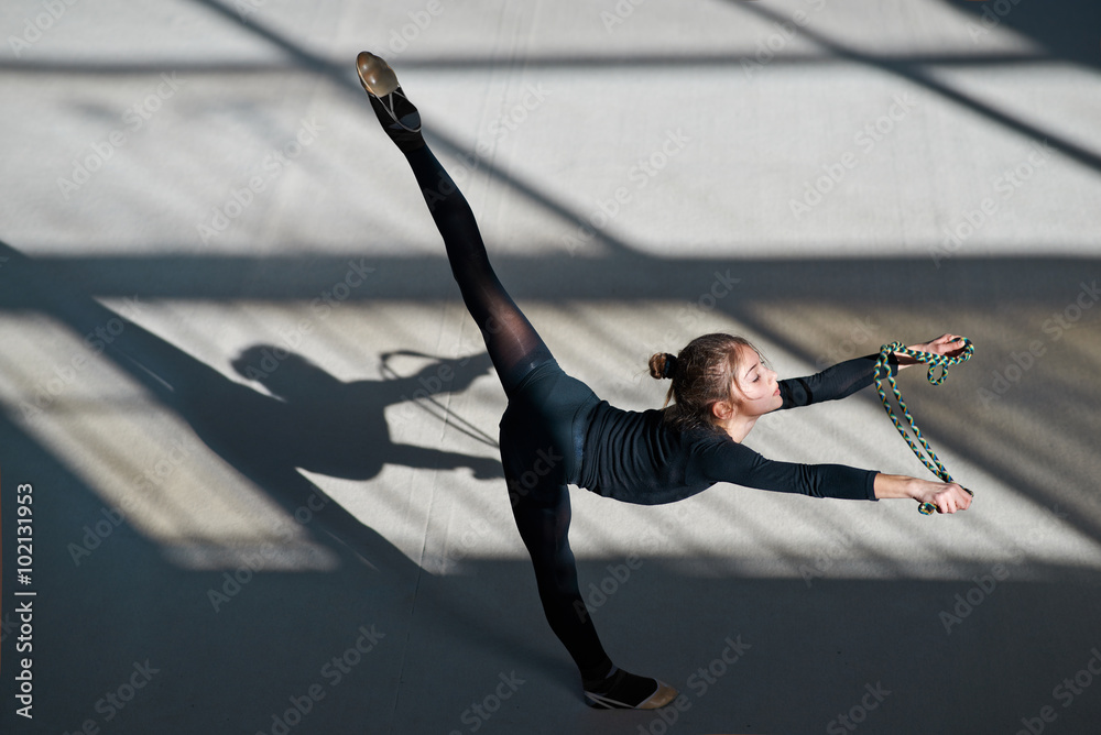 girl making balance rope. rhythmic gymnastics. Stock Photo | Adobe Stock