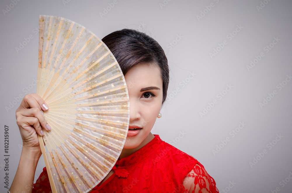 Beautiful Asian woman in traditional chinese costume holding fan Stock ...