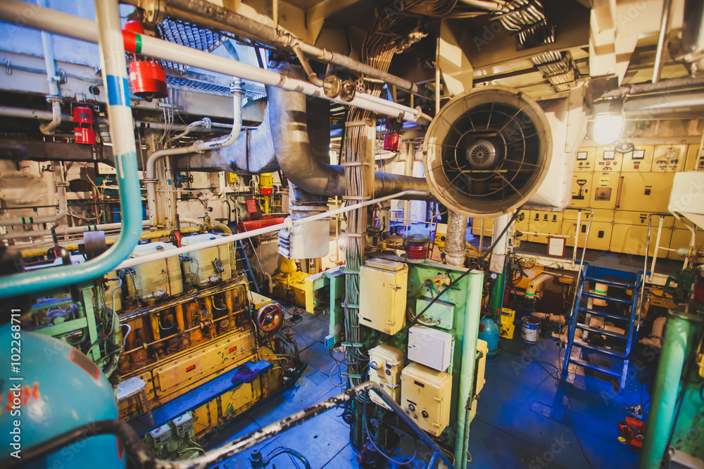 Engine Room on a cargo boat ship interior, ship's engine heavy ...