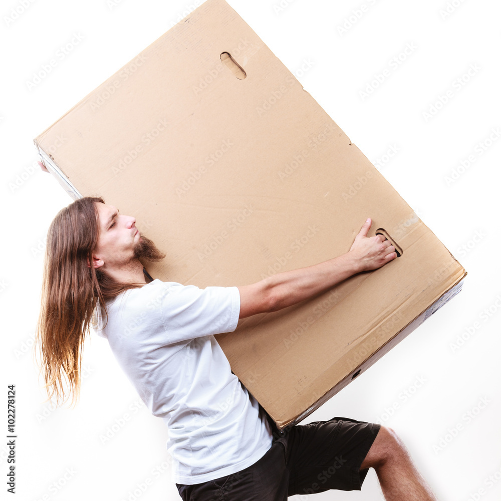 Delivery man holding a paper box. Stock Photo | Adobe Stock