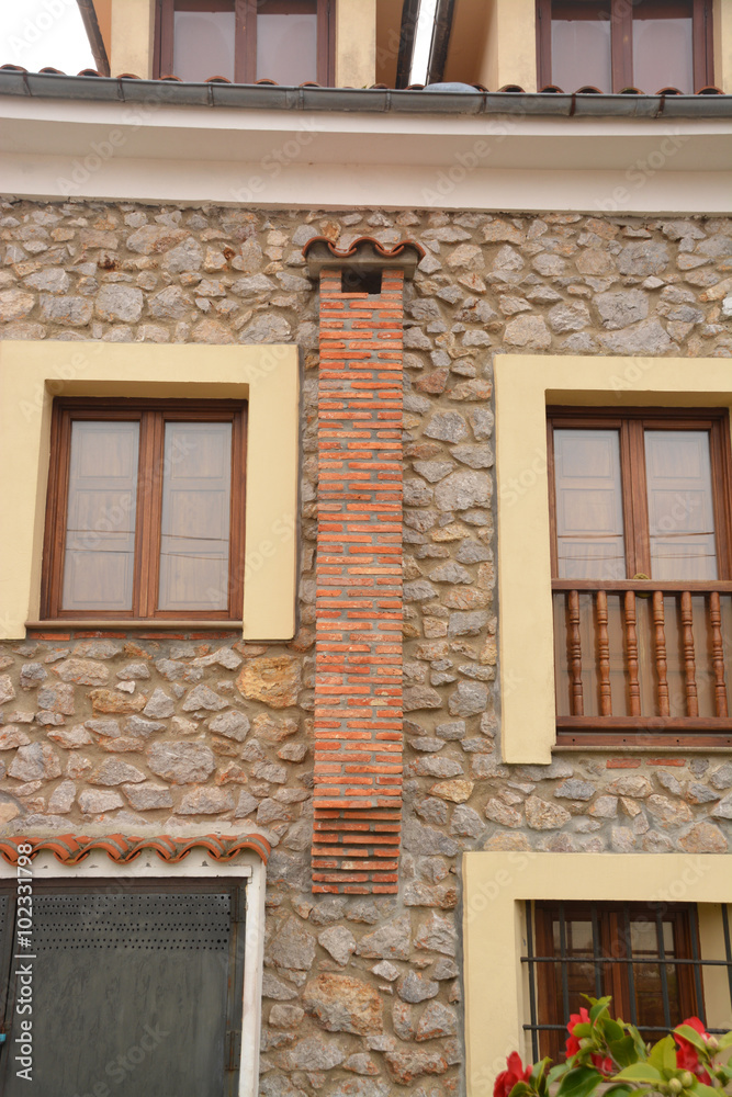 chimenea en la fachada de un edificio Stock Photo | Adobe Stock
