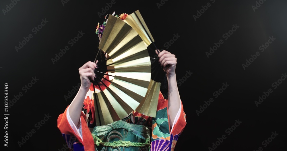 4K beautiful Japanese geisha dancing on stage and posing for the camera ...
