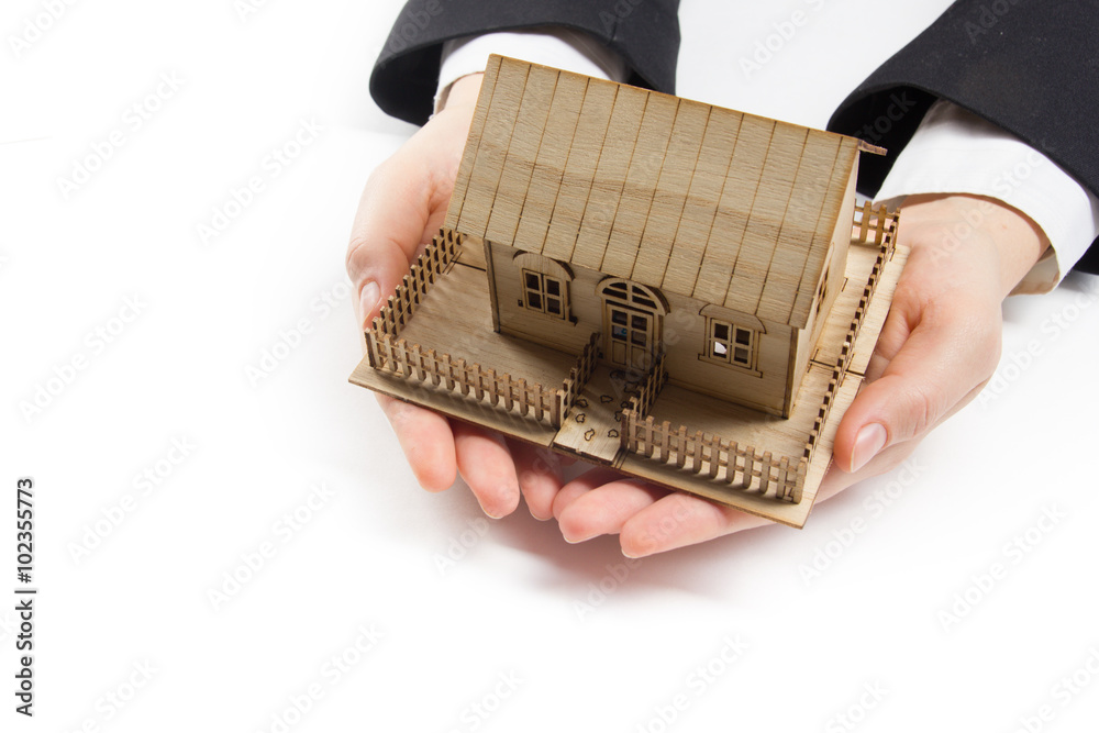 Hands holding small model of house. Real estate concept Stock Photo ...