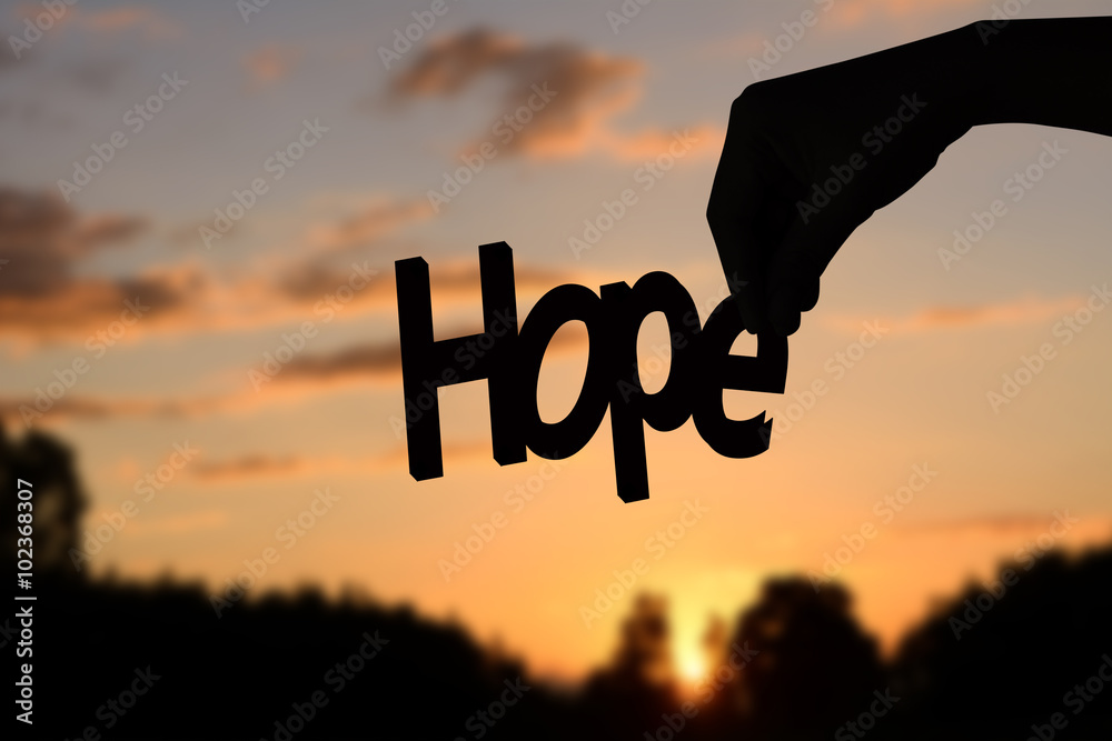 Silhouette hands holding the word hope. Background Sunset. Stock Photo ...