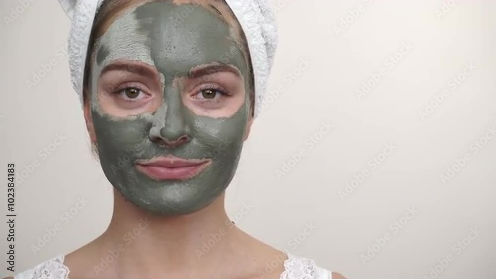 Woman with green clay mud mask on face 4K Stock Video | Adobe Stock