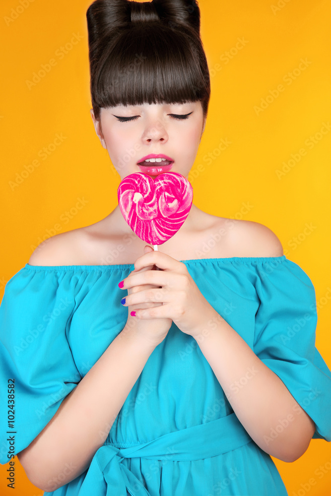 Lollypop candy. Beautiful teen girl eating colourful Heart lolli Stock ...
