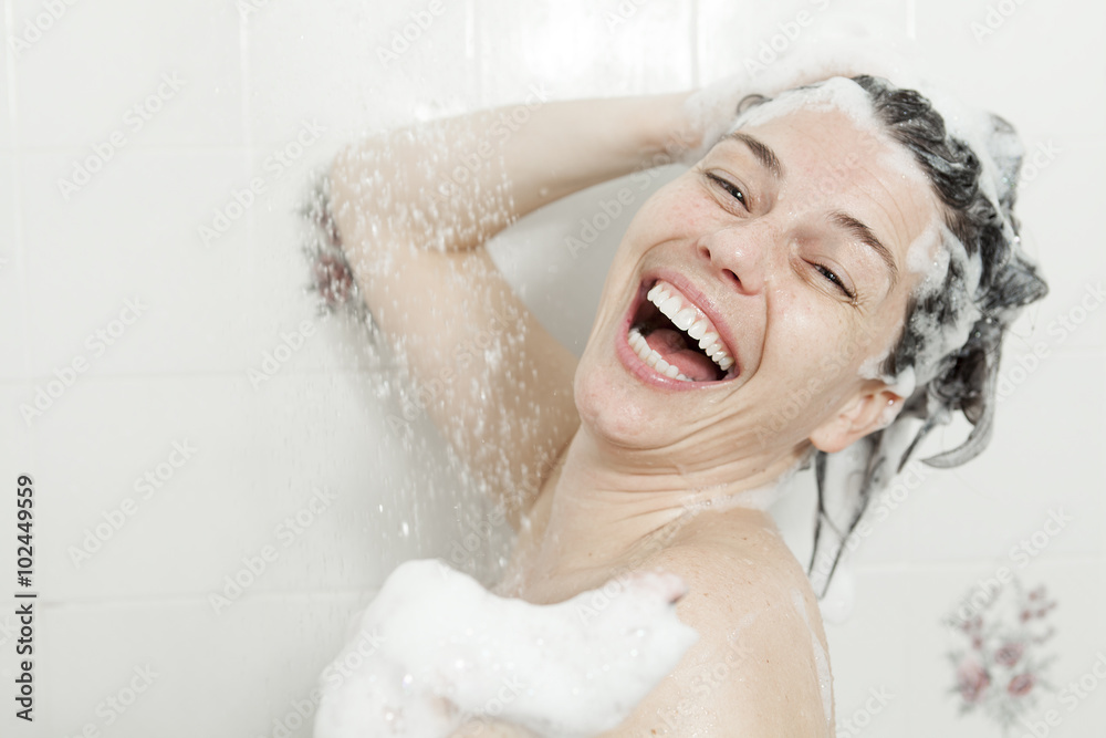 Shower woman. Happy smiling woman washing shoulder showering in Stock ...