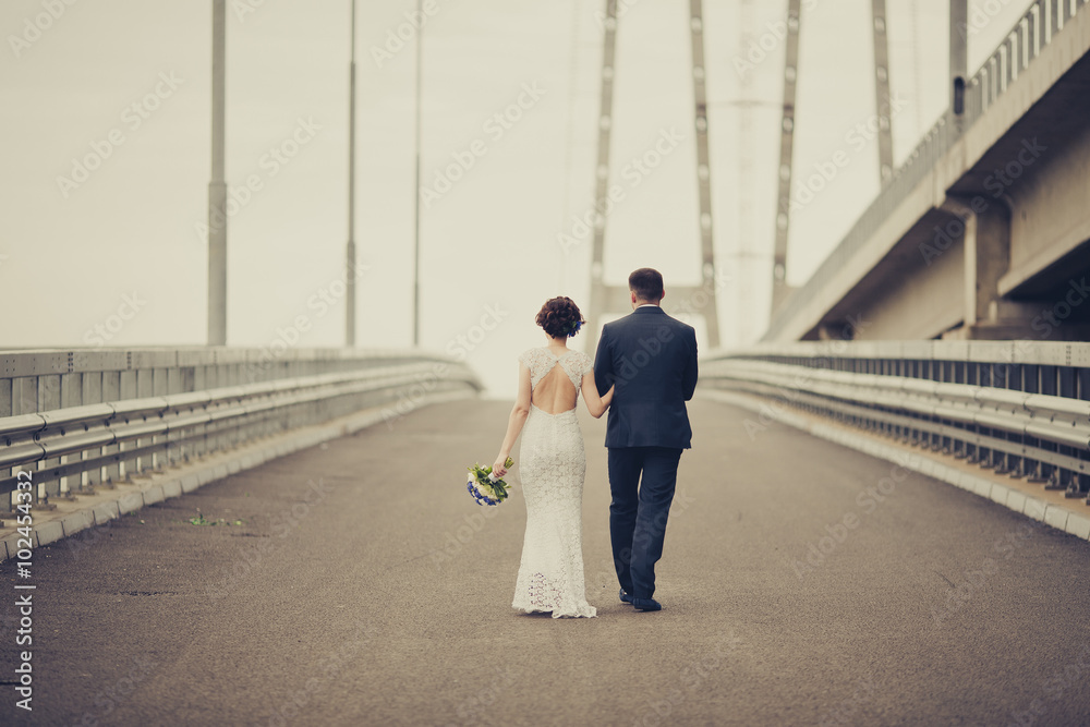 Happy bride and groom celebrating wedding day. Married couple going ...