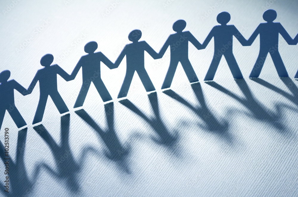 Paper people holding hands Stock Photo | Adobe Stock