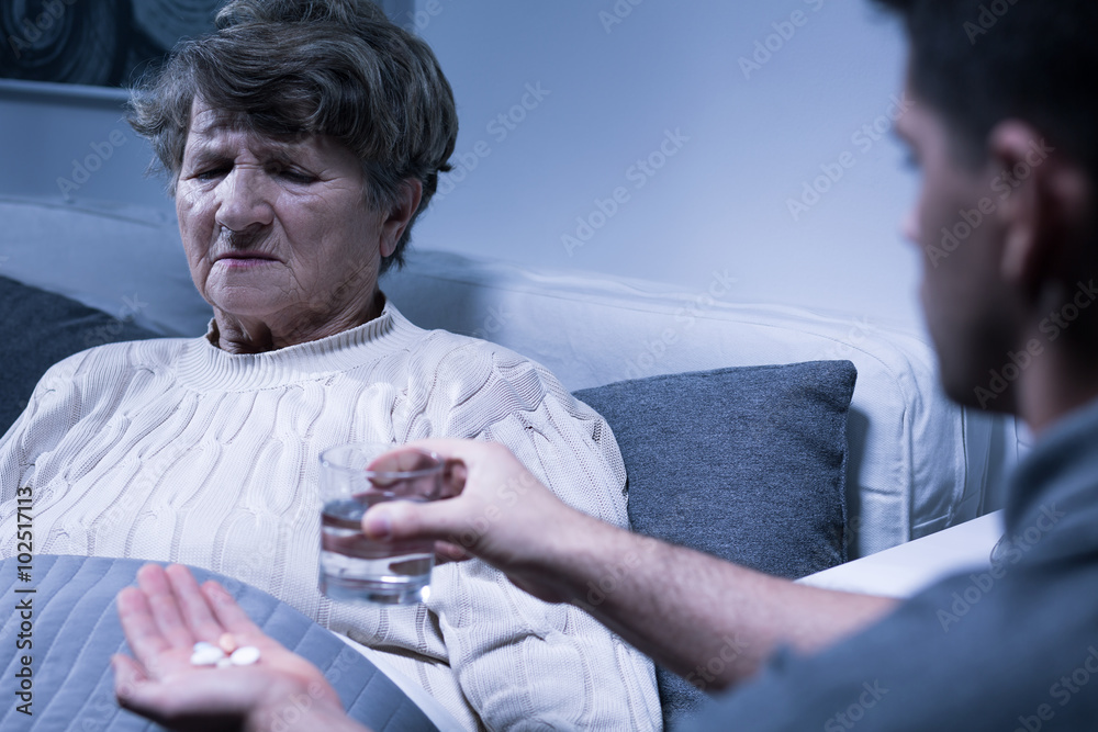 Grandson and sick grandmother Stock Photo | Adobe Stock