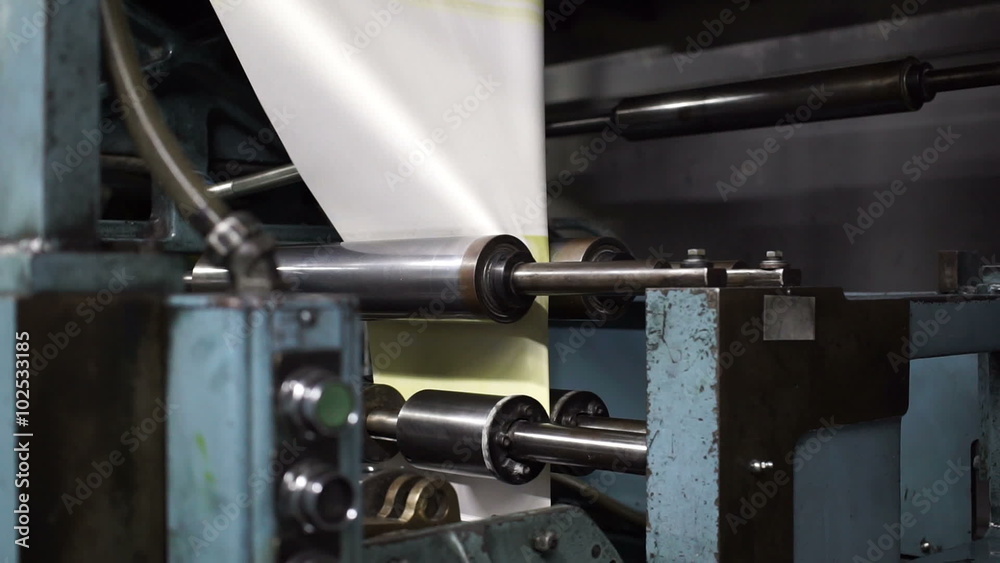 Close up shot of a newspaper printing press or offset printing press ...