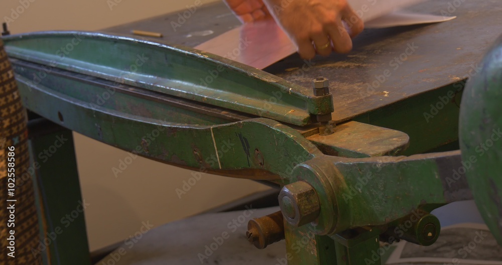 Man's Hands Cut The Copper Plate in Guillotine Installing the Copper ...