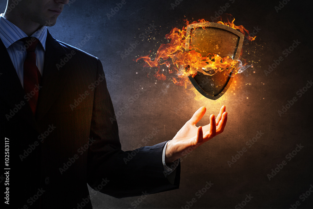 Shield burning in fire Stock Photo | Adobe Stock