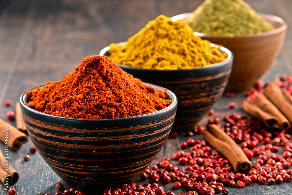 Variety of spices on kitchen table Stock Photo | Adobe Stock