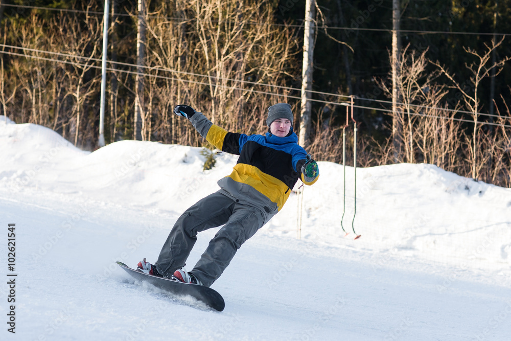 snowboarder laying turns on the ski slope Stock Photo | Adobe Stock