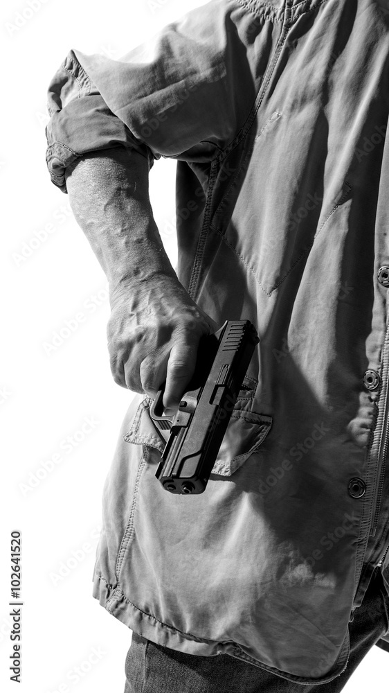 Man with a gun in his hand Stock Photo | Adobe Stock