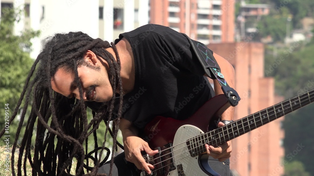 African Male Bass Guitarist With Dreadlocks Stock Video | Adobe Stock