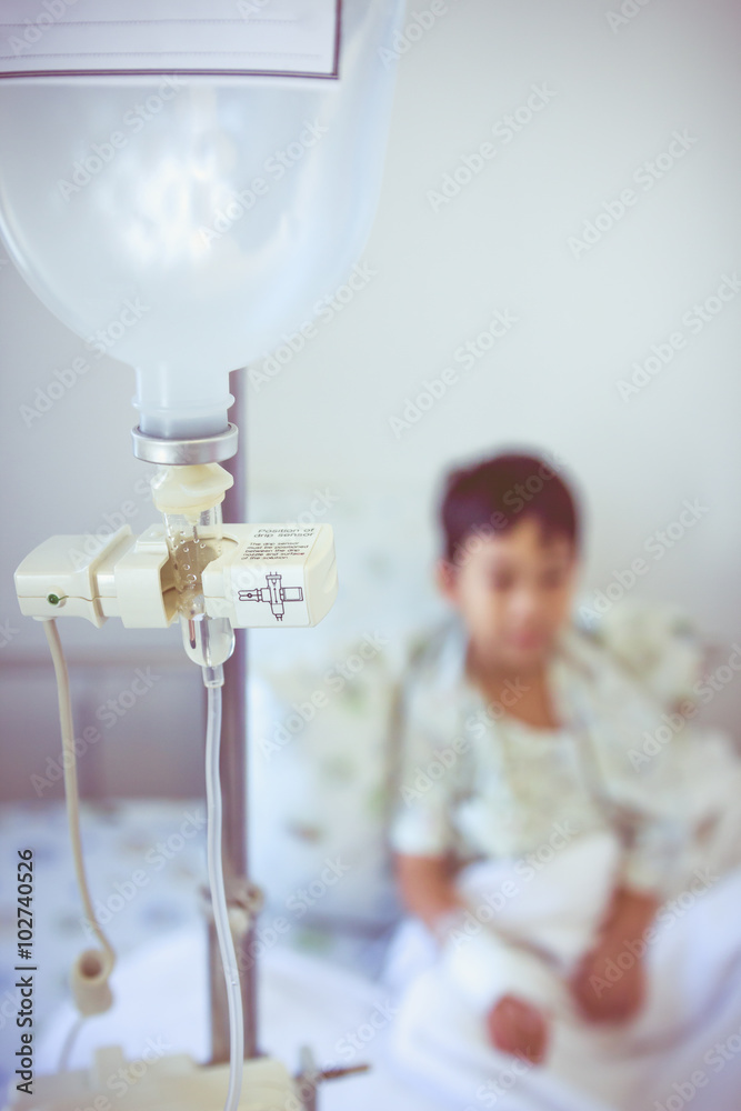 Poster Asian boy lying on sickbed with infusion pump intravenous IV ...