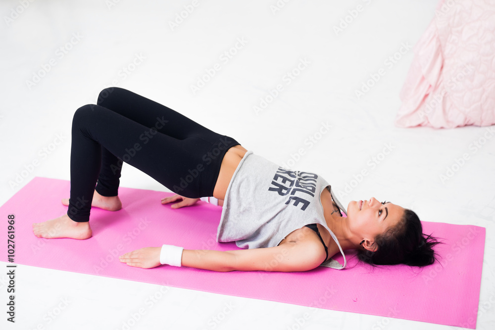 Bridge pose sporty woman doing warming up exercise for spine, backbend ...