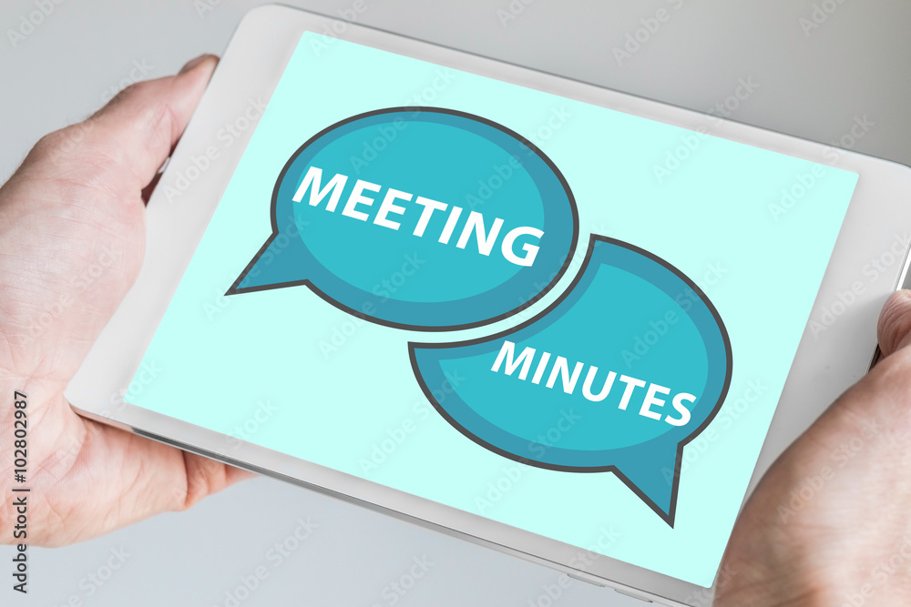 Meeting minutes concept with hands holding modern tablet or smartphone ...