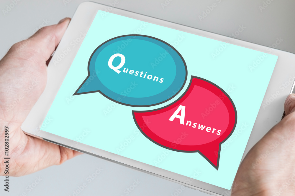 Questions and Answers Q&A session concept with hands holding modern tablet or smartphone to be ...