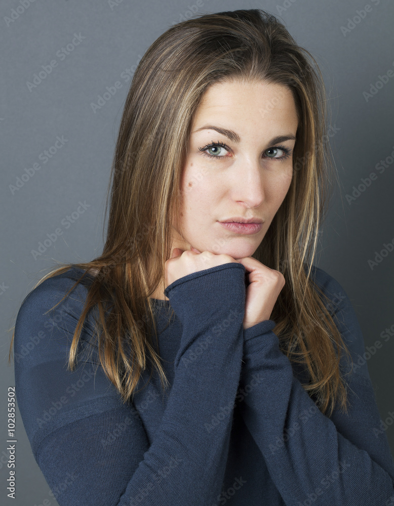 shyness concept - portrait of a reserved young beautiful girl acting ...