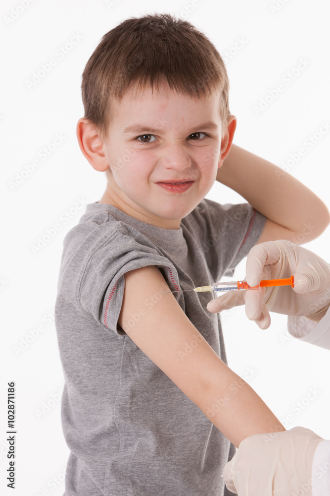 Doctor giving a child injection in arm on isolated image. Stock Photo ...