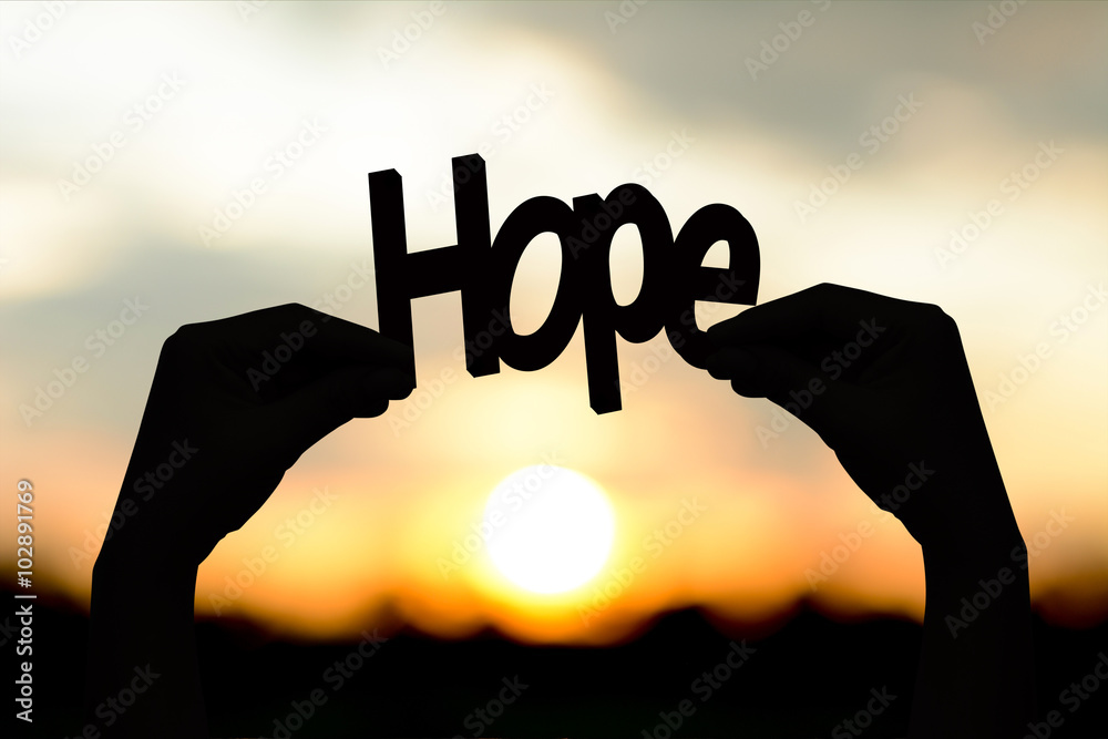 Silhouette hands holding the word hope. Background Sunset. Stock Photo ...
