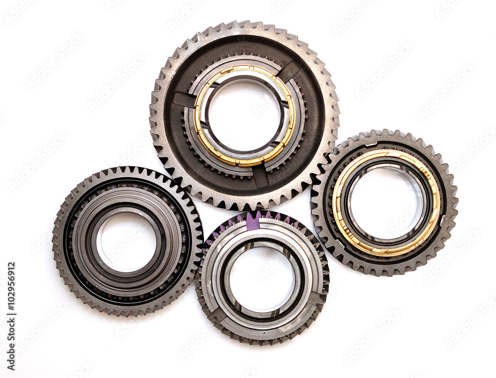 Four gears isolated. Stock Photo | Adobe Stock
